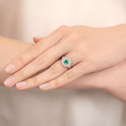 Contemporary .65 Carat Emerald and Diamond Ring